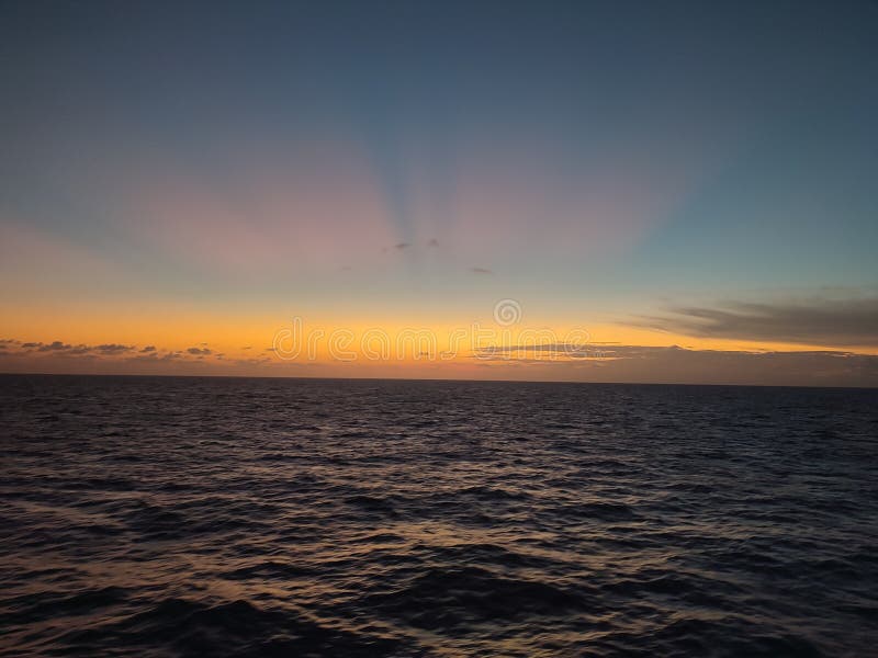 The Sun Shines in the Middle of the Vast Ocean of Indonesia Stock Photo ...