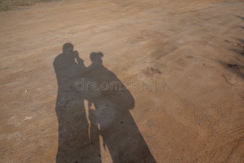 The Sun Shines Two People S Shadows on the Land Stock Image - Image of ...