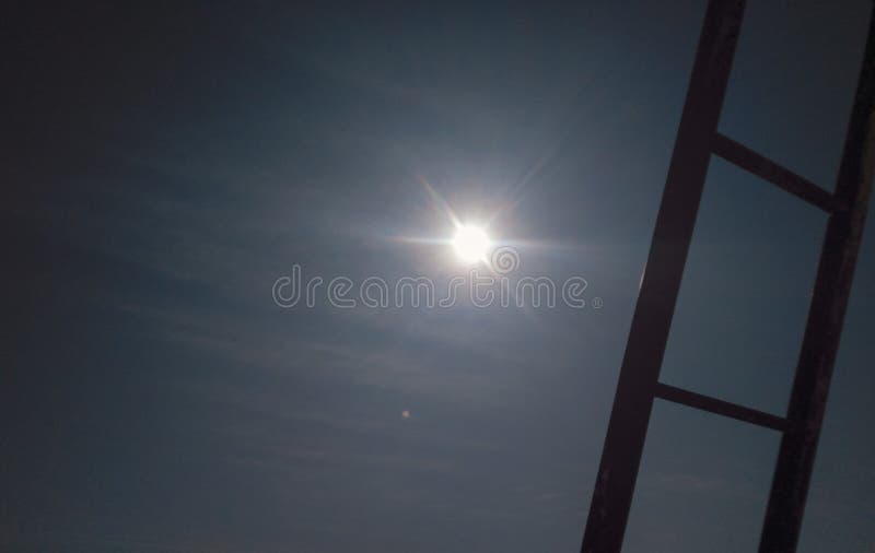 Sun Shining in the Blue Sky with White Clouds and Ladder Stock Image ...