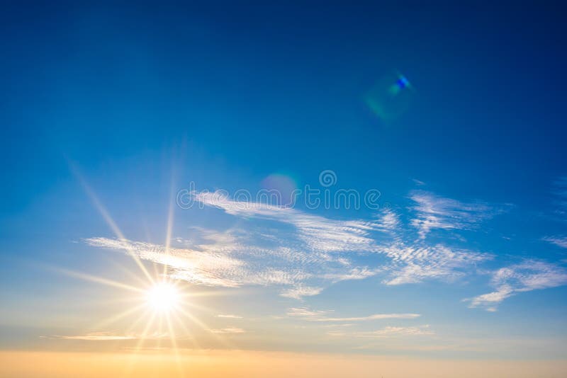 Sun shining on blue sky stock image. Image of sunrise - 194120063