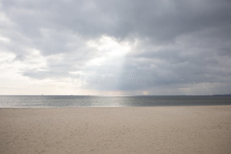Sun Shining through Clouds on Empty Beach by the Baltic Sea Stock Image ...