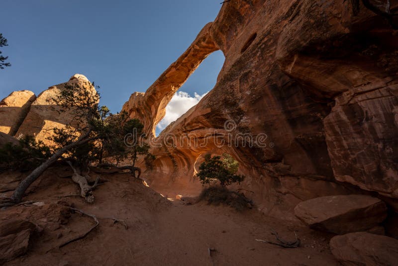 Sun Shining through Double O Arch Stock Photo - Image of devils, park ...