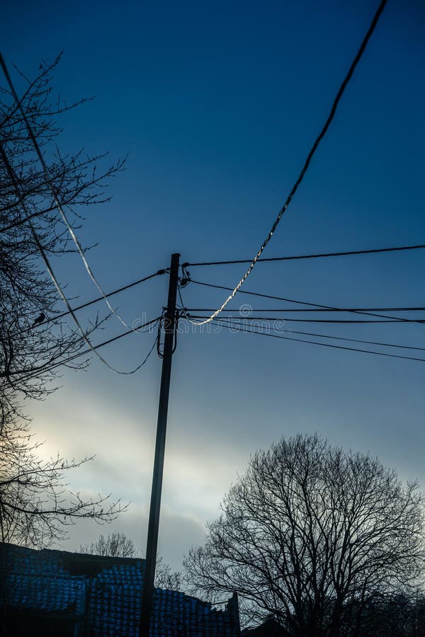 Sun Shining on Power Lines in the Evening.. Stock Image - Image of dawn, reflection: 313624525
