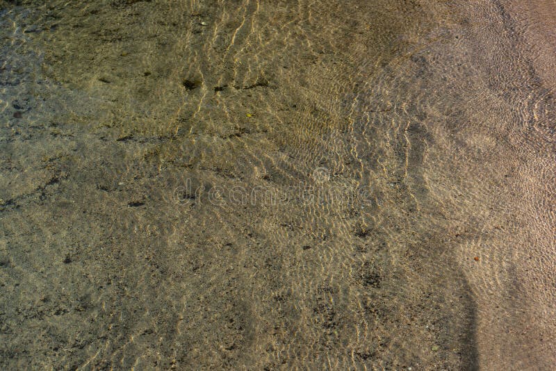 Sun Shining through Shallow Water on a Sand Beach.. Stock Photo - Image ...