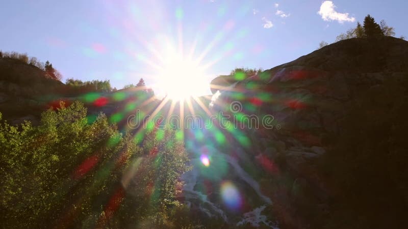 Waterfall with Sun Rays stock photo. Image of tranquil - 28723944