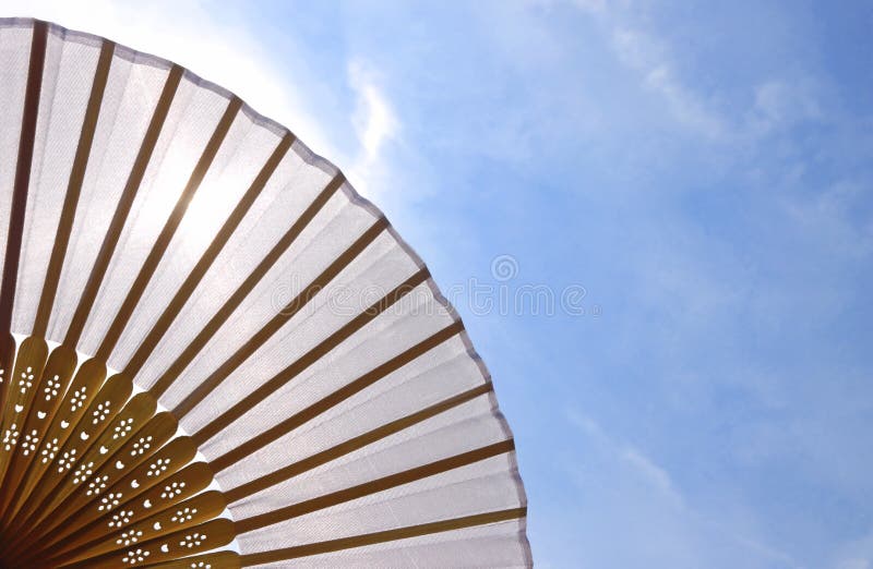 Sun Shining through a White Hand Fan Stock Photo - Image of hand ...