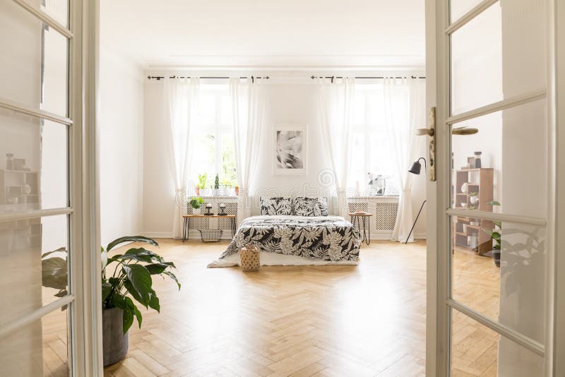 Sun Shinning through Windows into a Spacious Stylish Bedroom Interior ...