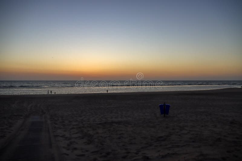 Sun Sinks into the Sea on the Beach of Katwijk with Colorful Sky Stock ...