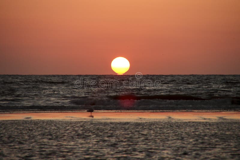 Sun Sinks into the Sea on the Beach of Katwijk with Colorful Sky Stock ...