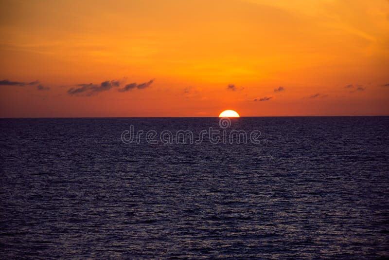 Sun Sinks into the Sea stock photo. Image of ripples - 73548014