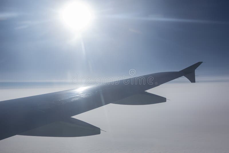 Sun in the Sky Above the Wing of a Flying Plane Stock Photo - Image of ...