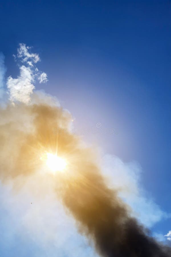 The Sun in the Sky through a Column of Smoke from a Large Fire among ...