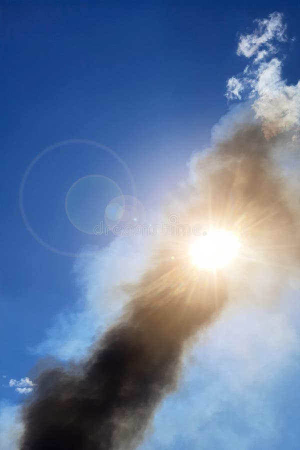 The Sun in the Sky through a Column of Smoke from a Large Fire among ...