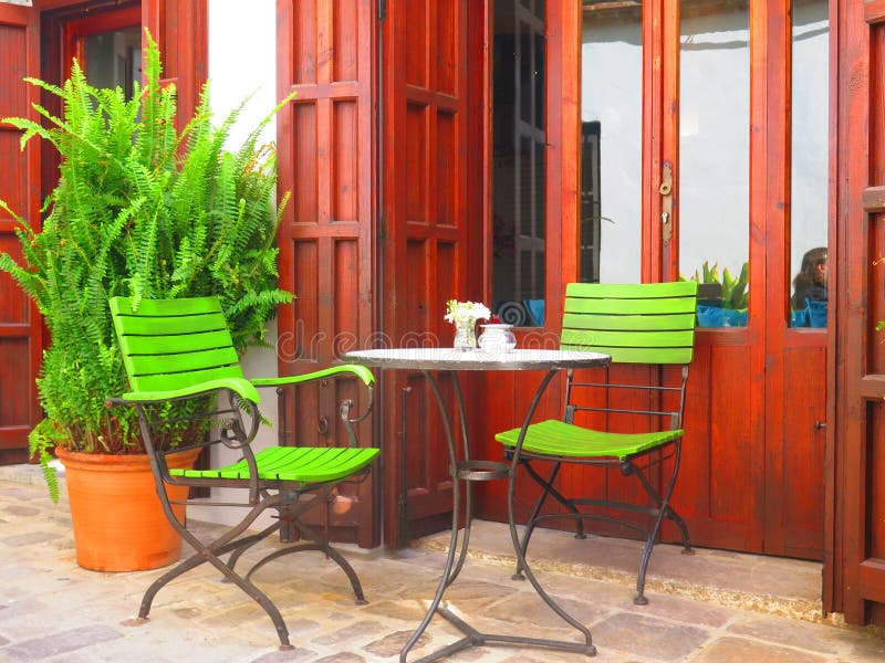 Sun on Spindly Chairs in Secluded Courtyard Stock Photo - Image of ...
