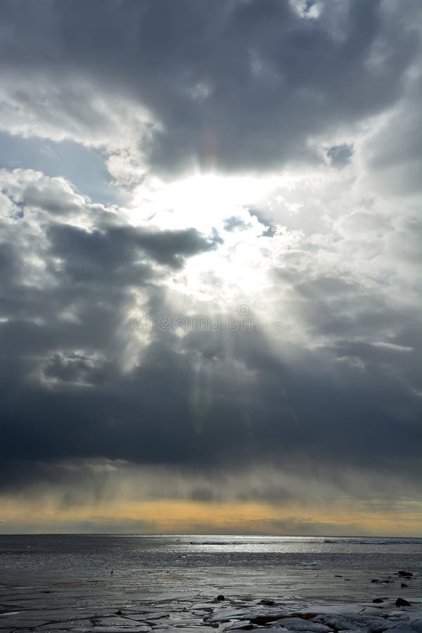 Sun through the Stormy Clouds at the Frozen Sea Stock Image - Image of ...