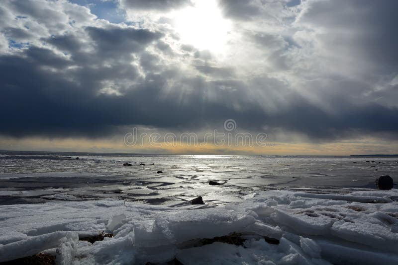 Sun through the Stormy Clouds at the Frozen Sea Stock Image - Image of ...