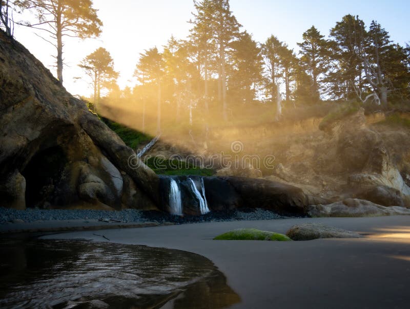 Sun Streaming Down the Cliff Over a Beach Waterfall at Hug Point in ...