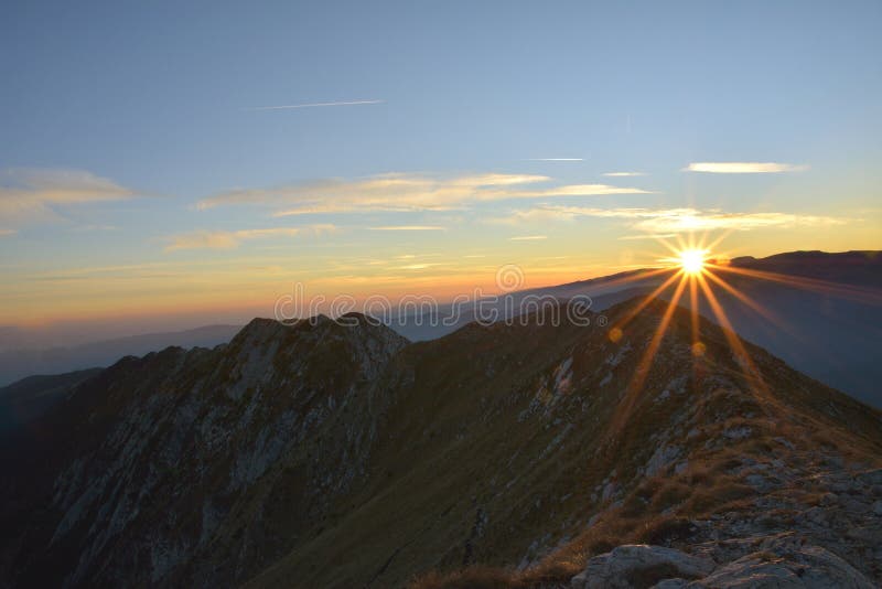 Sun with Sunlight Over Mountains on Blue Sky. Stock Photo - Image of ...