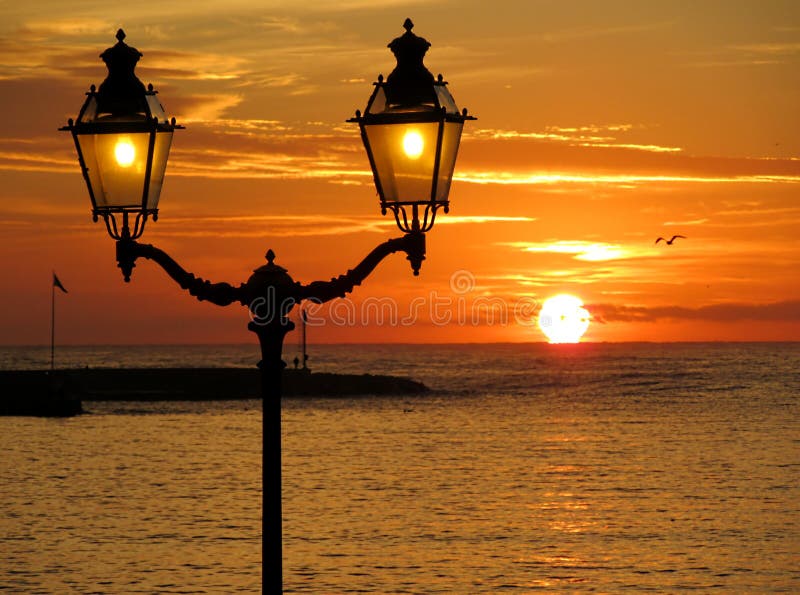 Sun at sunrise stock photo. Image of sunrise, streetlights - 64807354