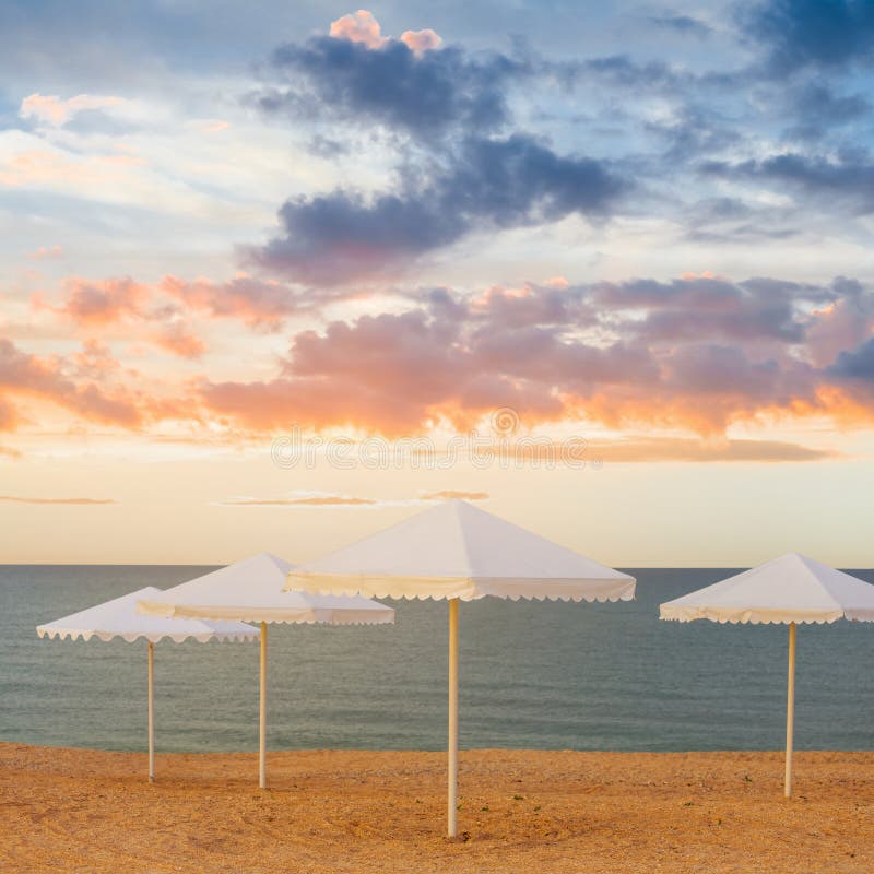 Sun Umbrella Stay on Sandy Sea Beach at the Evening Stock Photo - Image ...