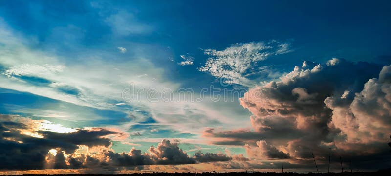 The Sun Was Setting in the Blue Sky Stock Photo - Image of setting ...