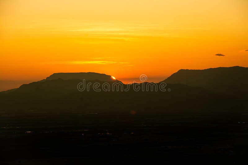 The Sun Was Setting on the Edge of the Ridge Mountain. Sunset Stock ...