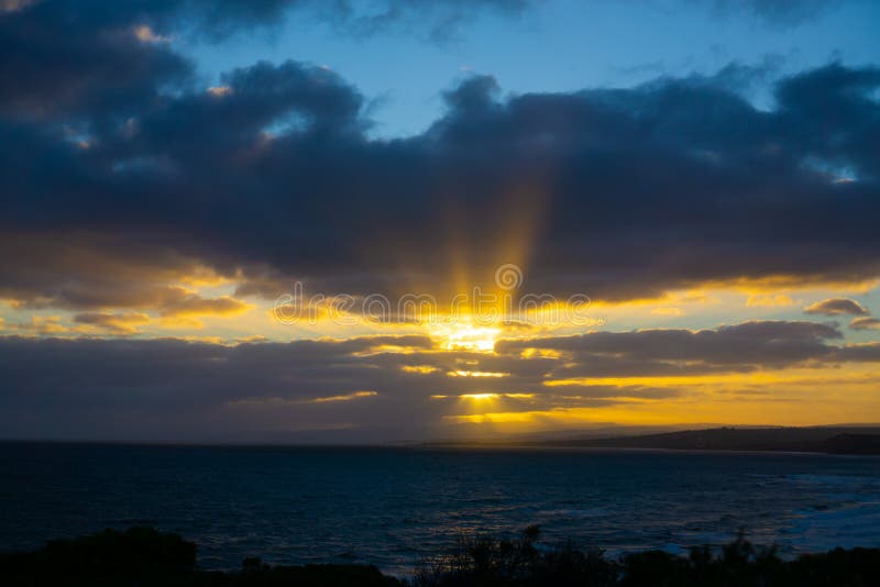 Sunbeam Behind Cloud with Sea Below Stock Photo - Image of scenery ...