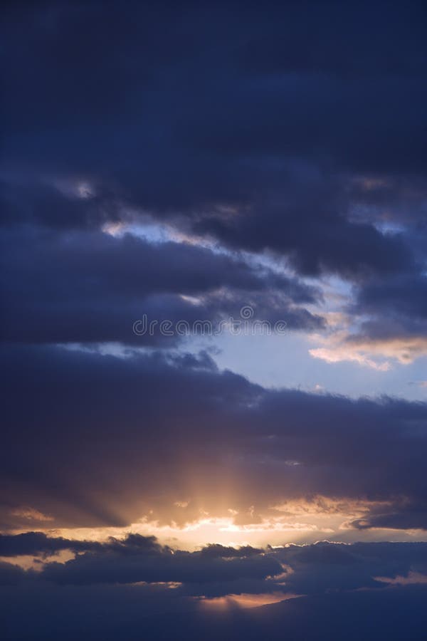 Sun rays behind clouds stock image. Image of storm, rain - 1167283