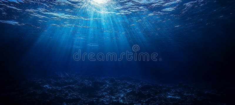 Sunbeams Piercing the Surface of Deep Blue Ocean Waters, Illuminating ...