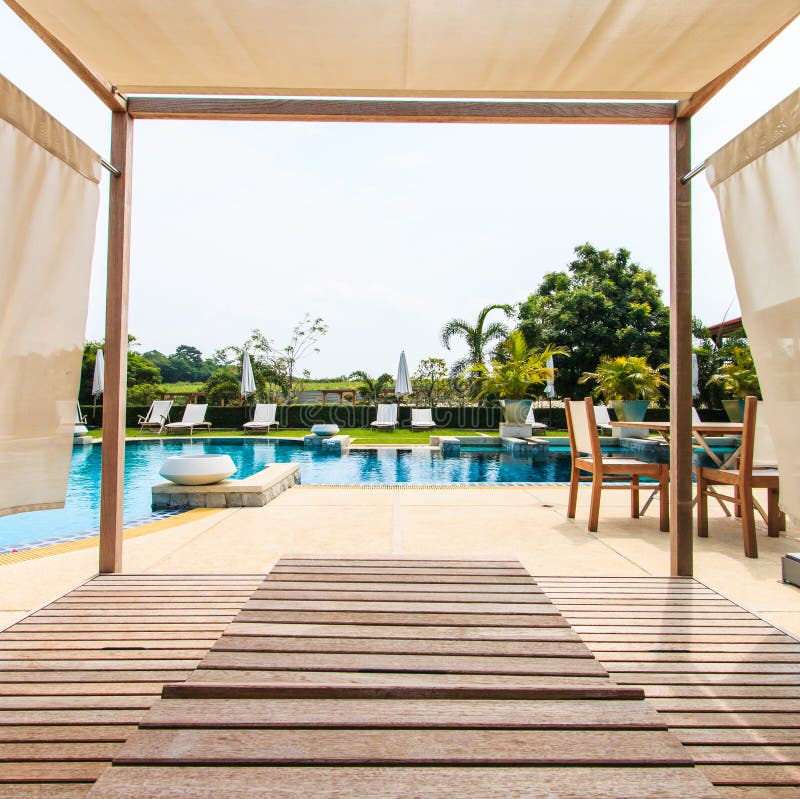 Sunbed Chair and Swimming Pool Stock Photo - Image of relax, scenic ...