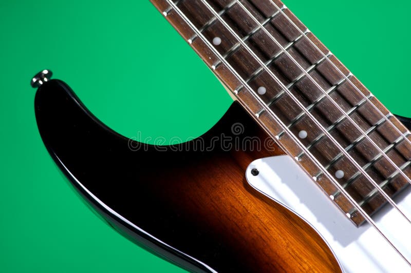 Sunburst Bass Guitar Isolated on Red Stock Photo - Image of vertical ...