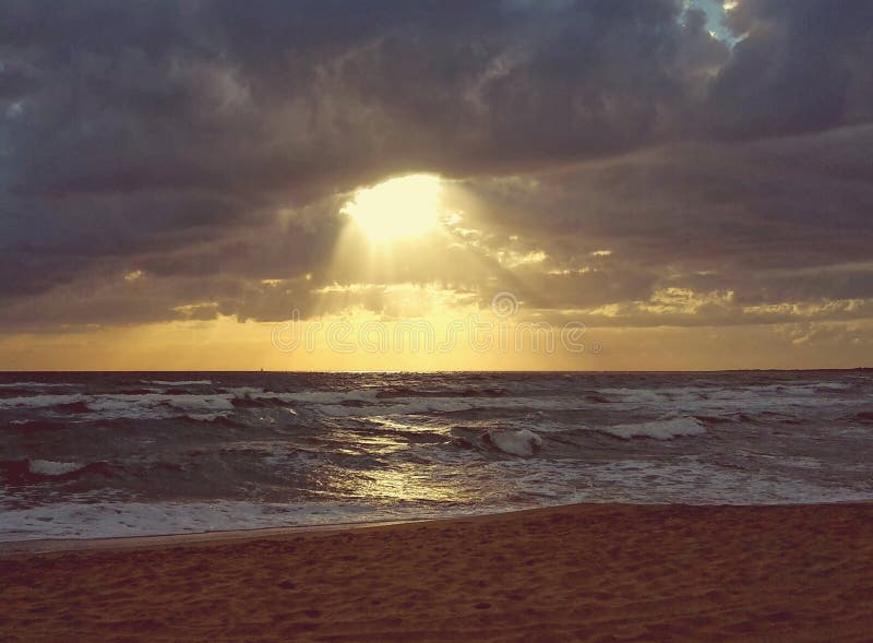 Sunburst beach stock photo. Image of sunrise, hole, clouds - 56851810