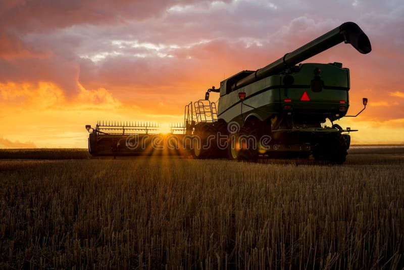 Sunburst through Combine at Sunset on the Prairies in Saskatchewan ...