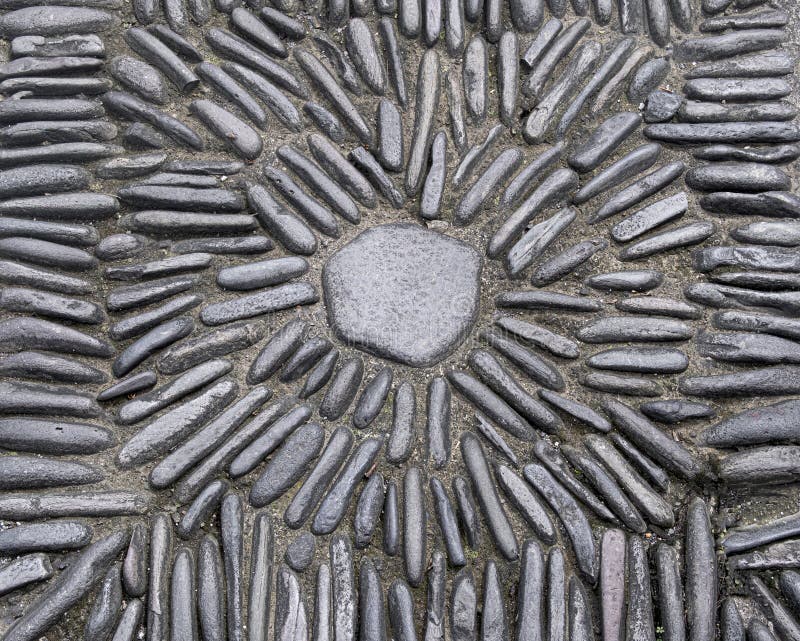Sunburst Design with Stones in Concrete Wall Texture Stock Image ...