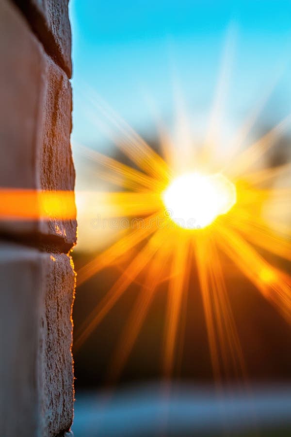 Sunburst Effect Over Brick Wall at Sunset with Colorful Sky Stock ...