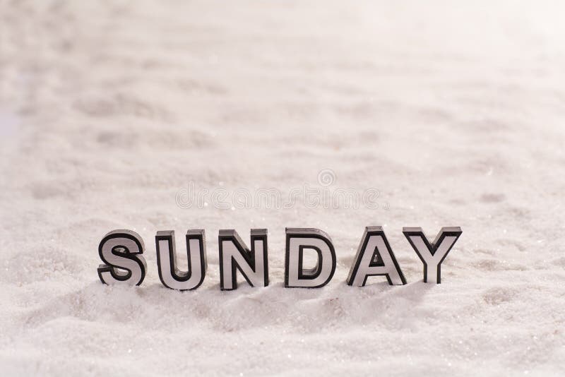 Word Sunday Written In Sand Beach, Sunlight Reflex. Stock Photo - Image ...