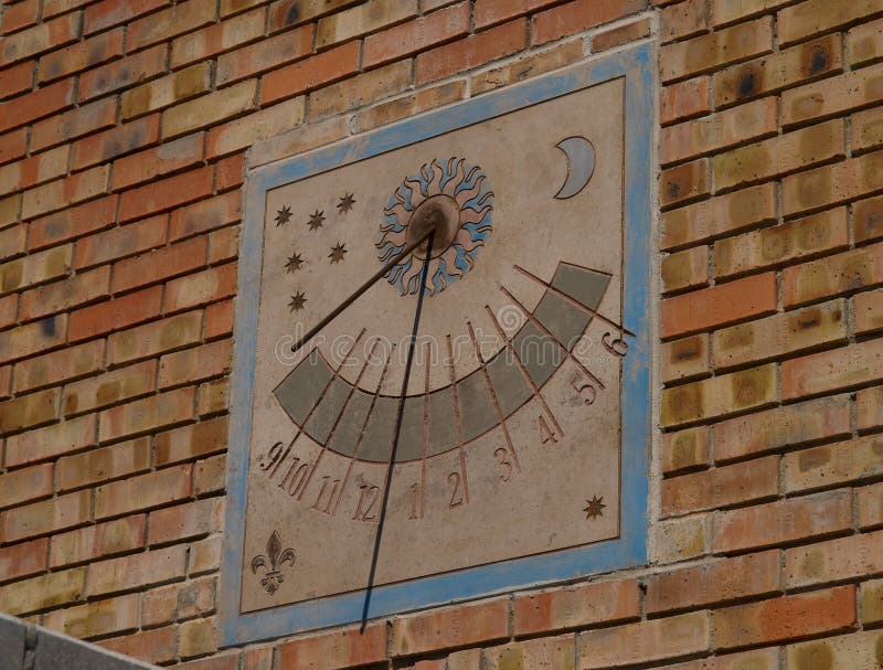 Sundial installed on wall stock image. Image of vintage - 89764825
