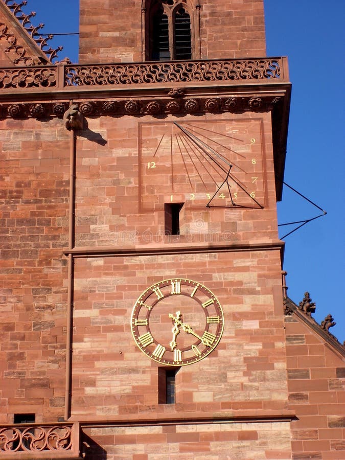 Sundial and Mechanic Clock on Basel Cathedral Stock Photo - Image of ...