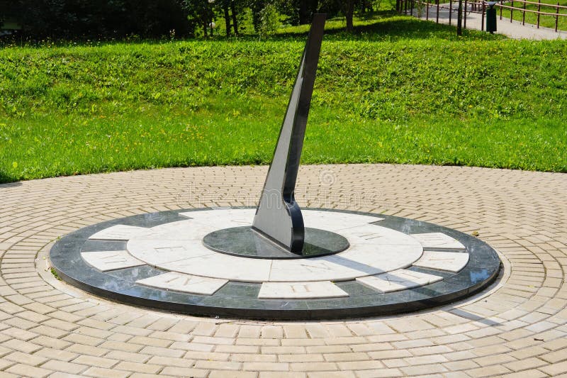 Sundial Showing Noon in the Park. Determination of Time Stock Photo ...
