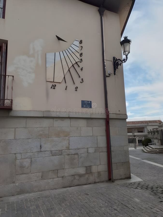 Sundial on Stone Building with Street Sign Stock Photo - Image of ...