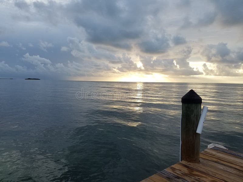 Sundown stock image. Image of dock, sunset, pier, water - 78885107