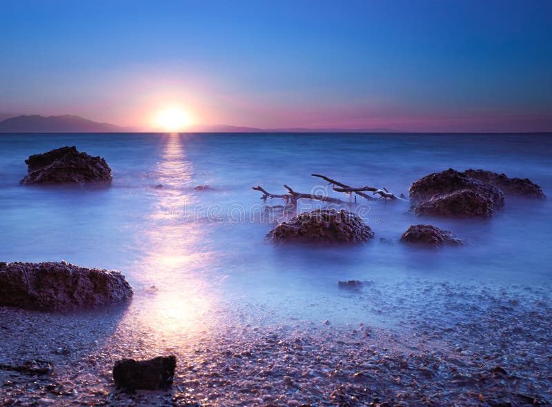 Sundowner at the beach stock image. Image of wave, sunrise - 270190857