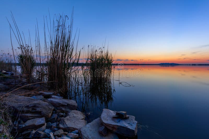 Sunet over lake stock image. Image of natural, blue - 123251481