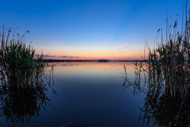 Sunet over lake stock image. Image of blue, outdoors - 76192907