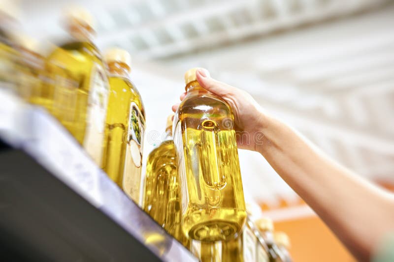 Sunflower oil in hand stock photo. Image of business - 301747098