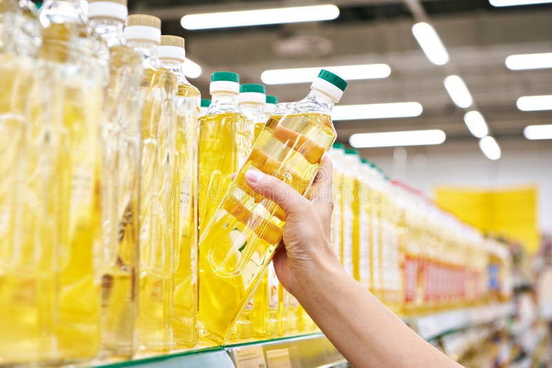 Sunflower oil in store stock photo. Image of customer - 253917908