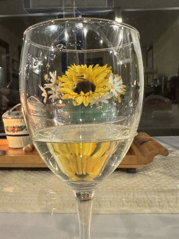 Sunflower Reflection through Wine Glass Stock Photo - Image of liqueur ...