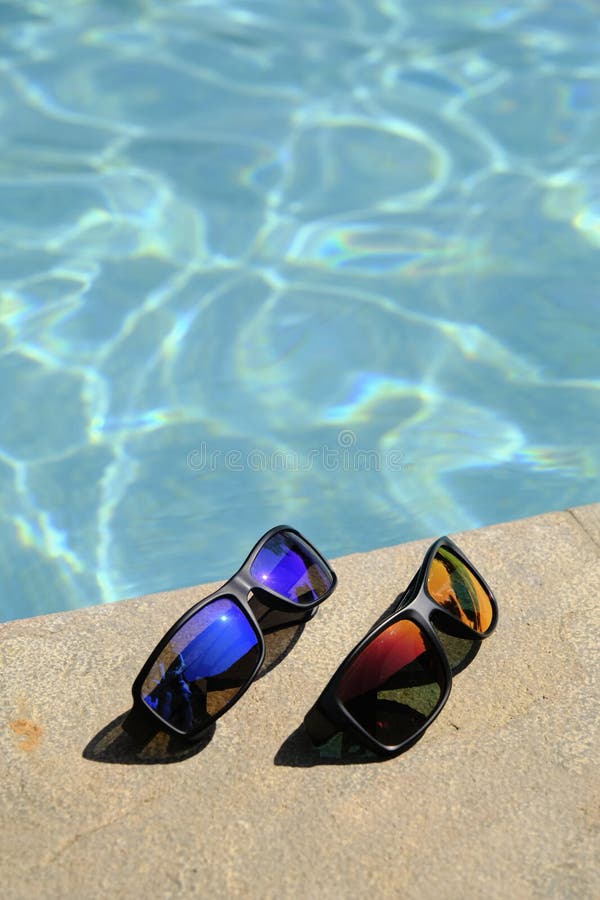 Sunglasses on the Background of the Pool Stock Photo - Image of ...