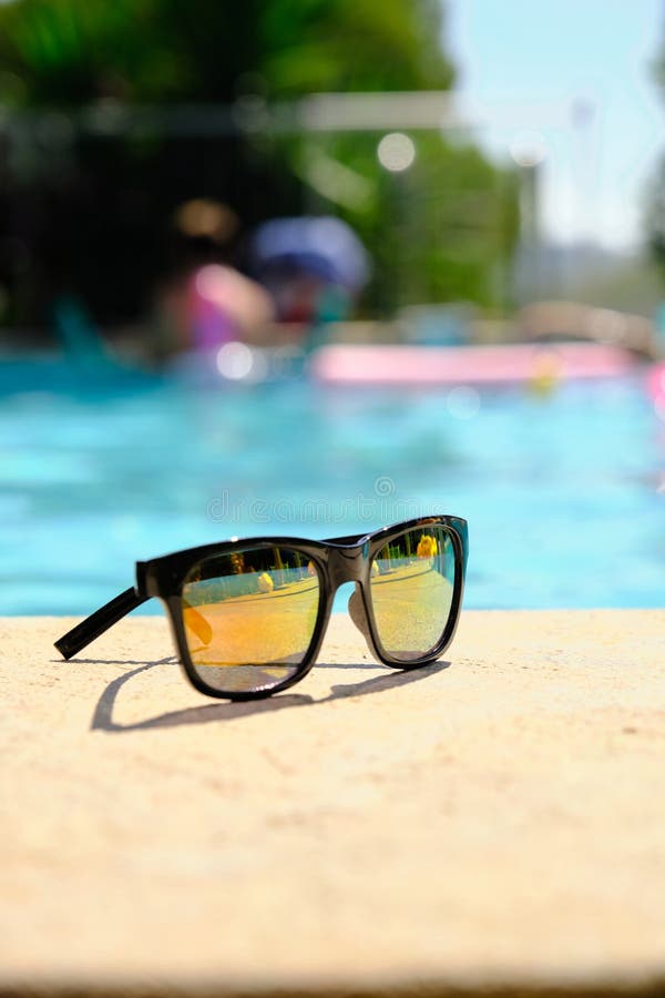 Sunglasses on the Background of the Pool Stock Image - Image of screen ...