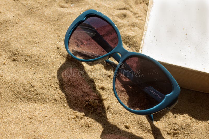 Sunglasses and Book Over Sand Stock Image - Image of glasses, copy ...